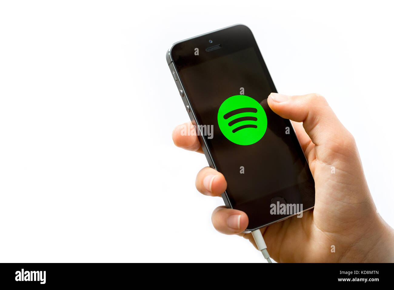 A teenage boy using the Spotify App on a mobile phone Stock Photo - Alamy