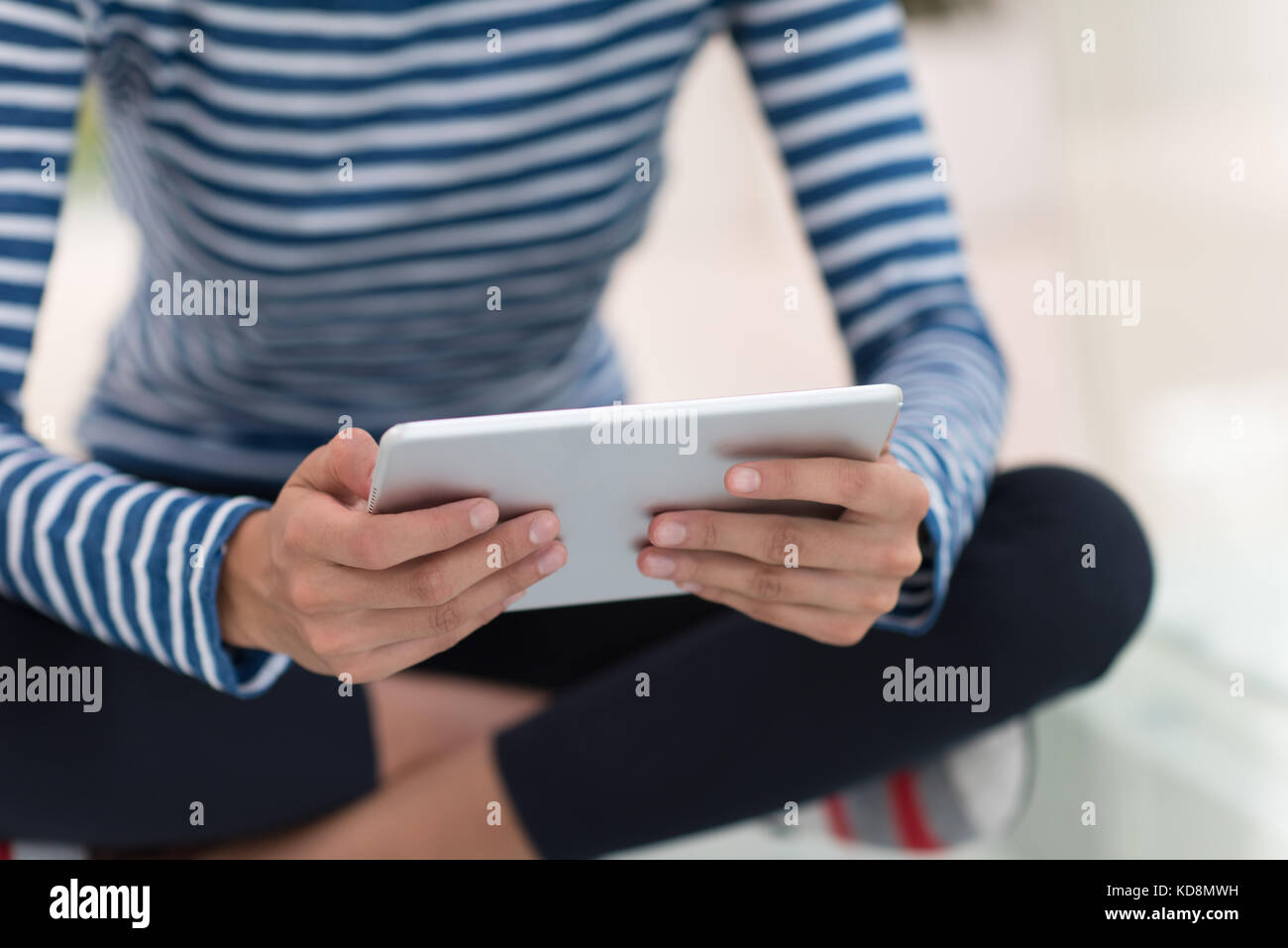 beautiful young women using tablet computer on the floor at home Stock ...