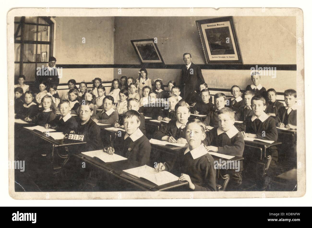 Edwardian postcard of junior school children - mixed boys and girls, in ...