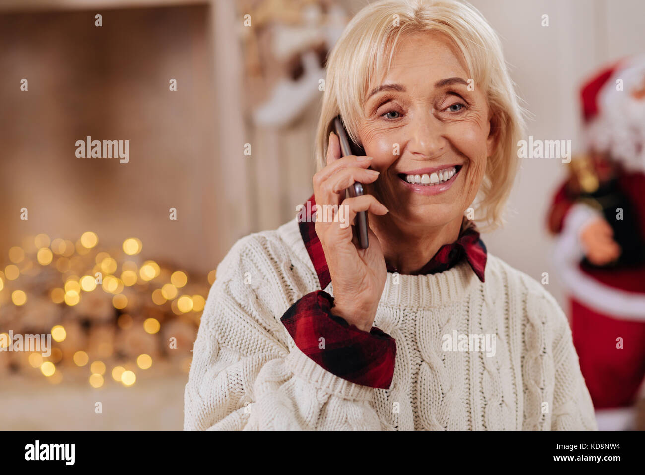 Delighted woman being Christmas inspired Stock Photo - Alamy