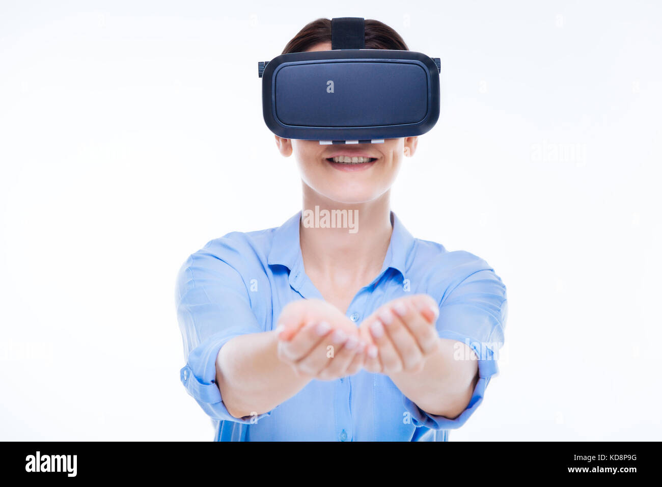 Happy nice woman being in virtual reality Stock Photo - Alamy