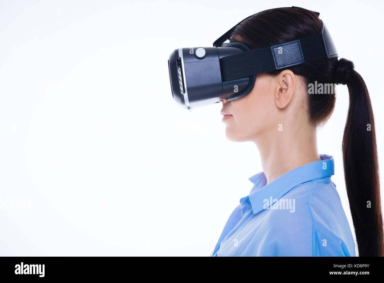 Nice attractive woman standing half face Stock Photo - Alamy