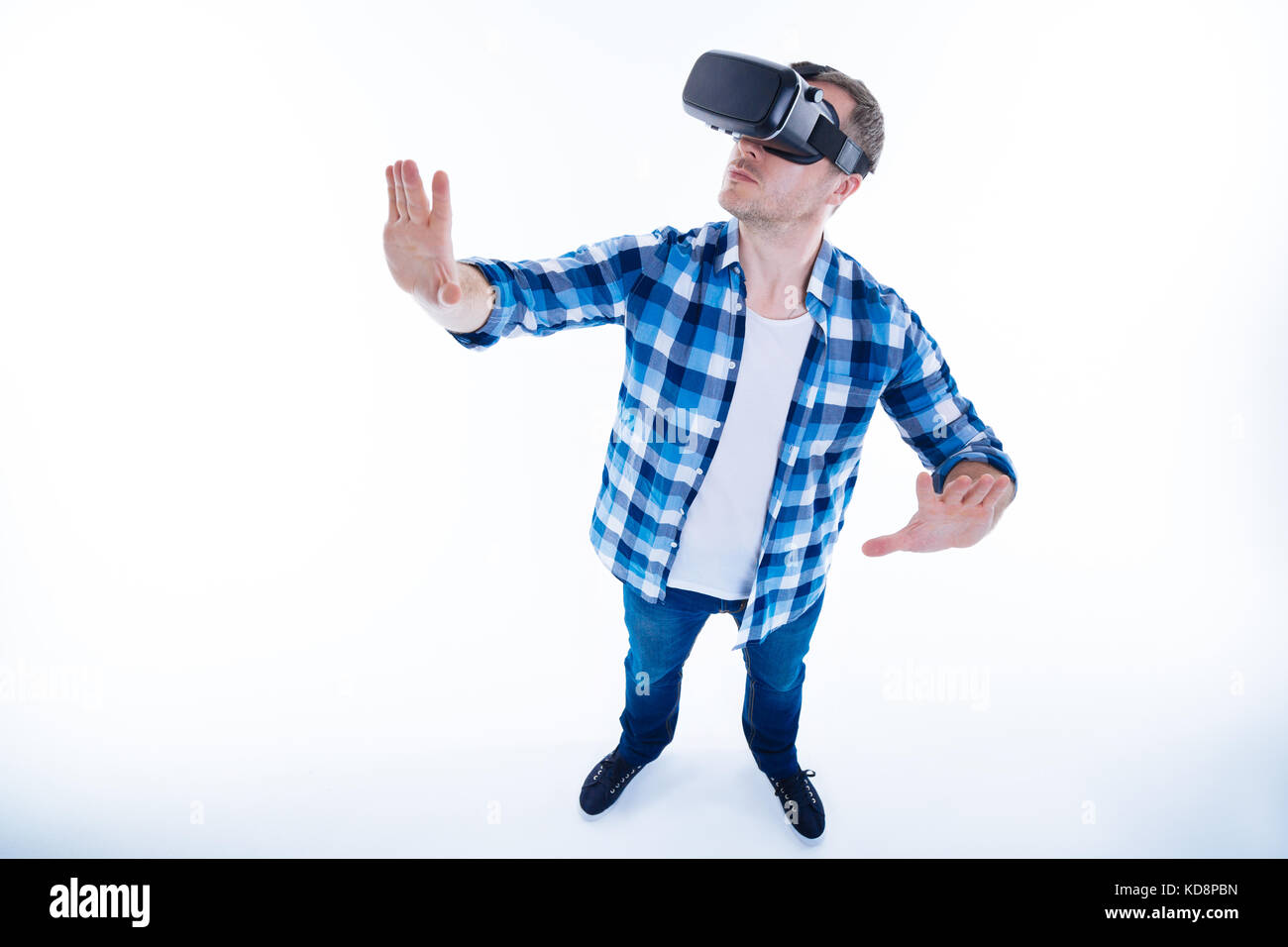 Handsome good looking man being in a virtual reality Stock Photo - Alamy