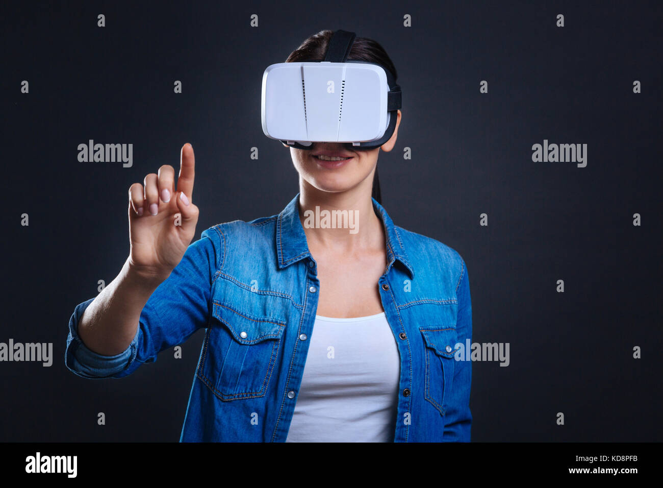 Joyful positive woman using sensory screen Stock Photo - Alamy