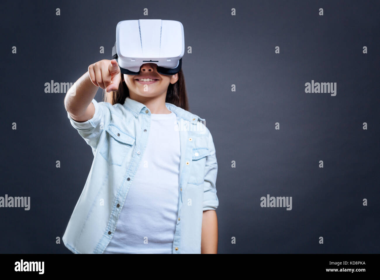 Positive pretty girl pointing at you Stock Photo - Alamy
