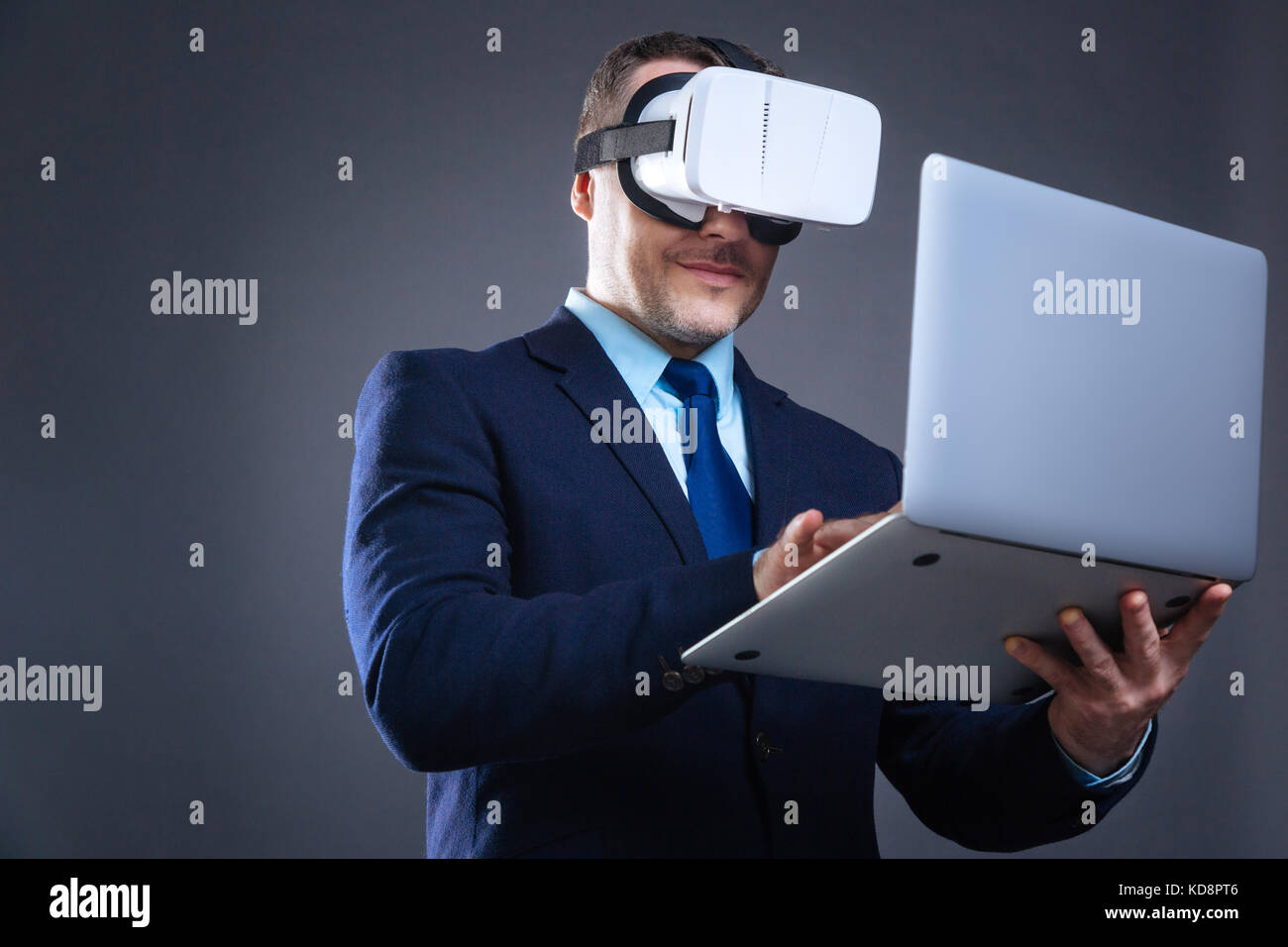 Positive smart man testing modern technologies Stock Photo - Alamy