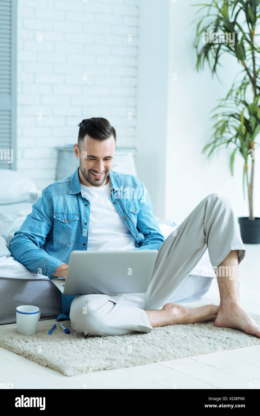 Smiling millennial freelancer enjoying working at home Stock Photo - Alamy