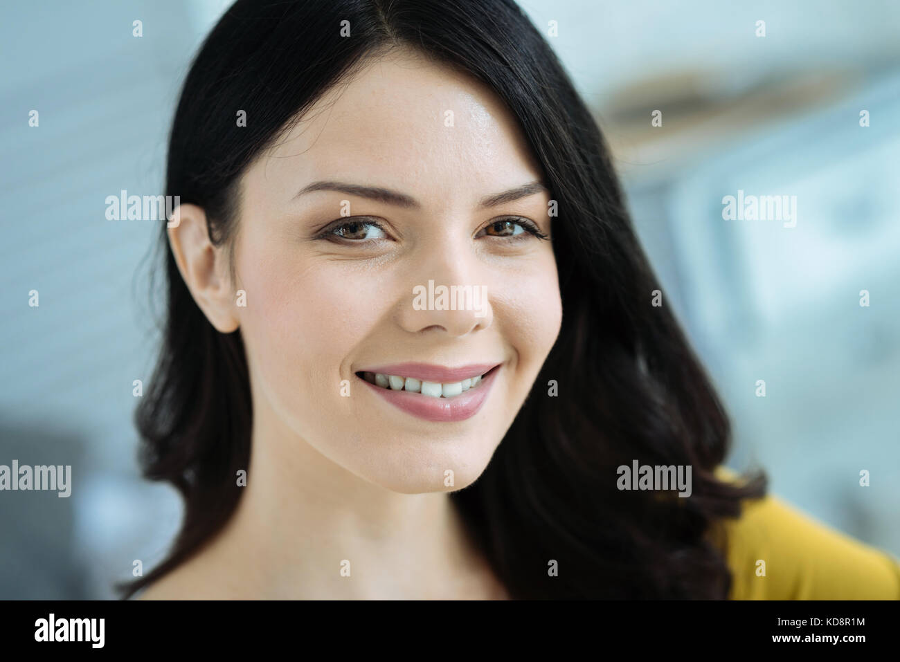 Portrait of young brunette smiling into camera Stock Photo - Alamy