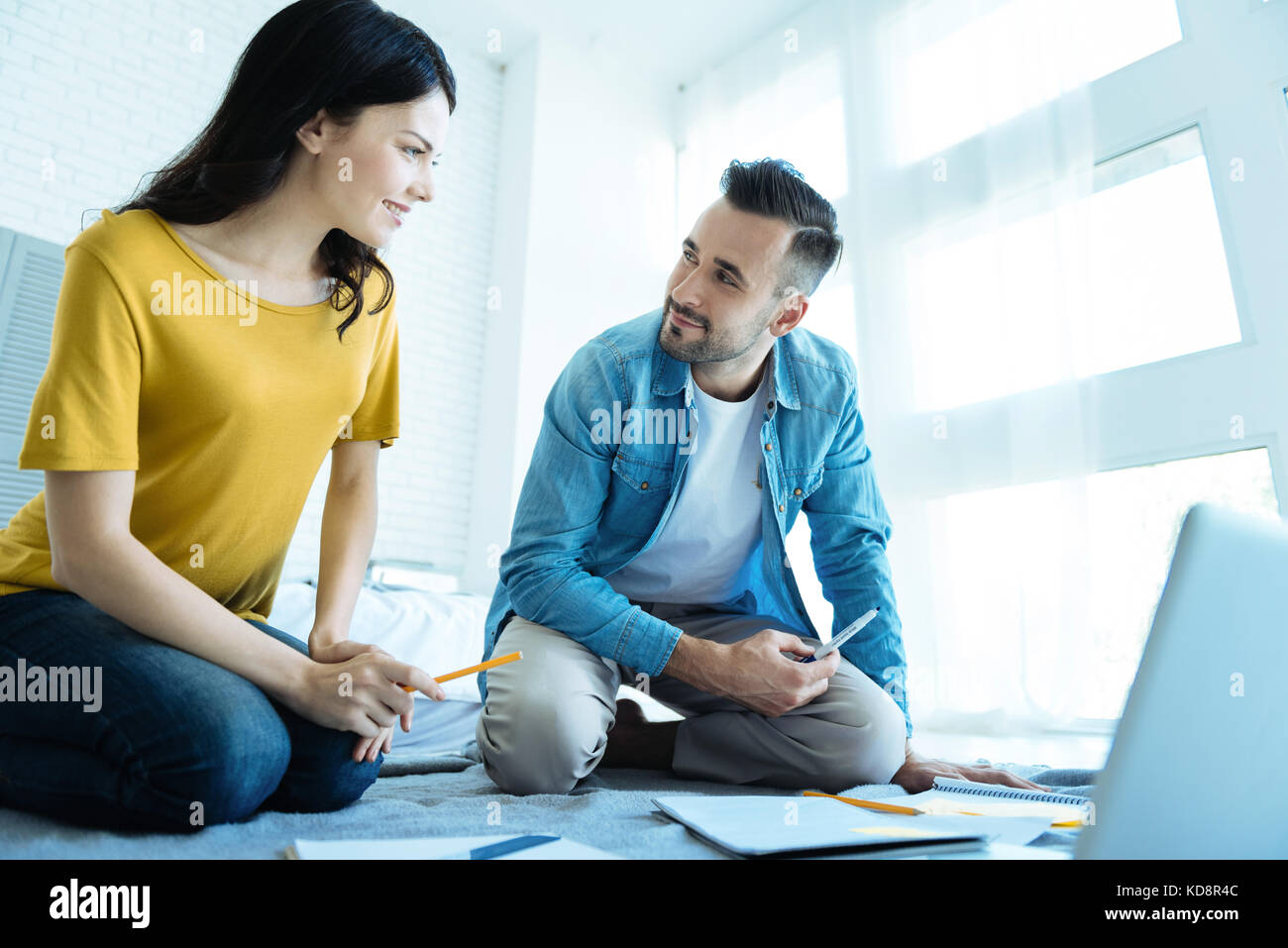 Cheerful young people working together Stock Photo - Alamy