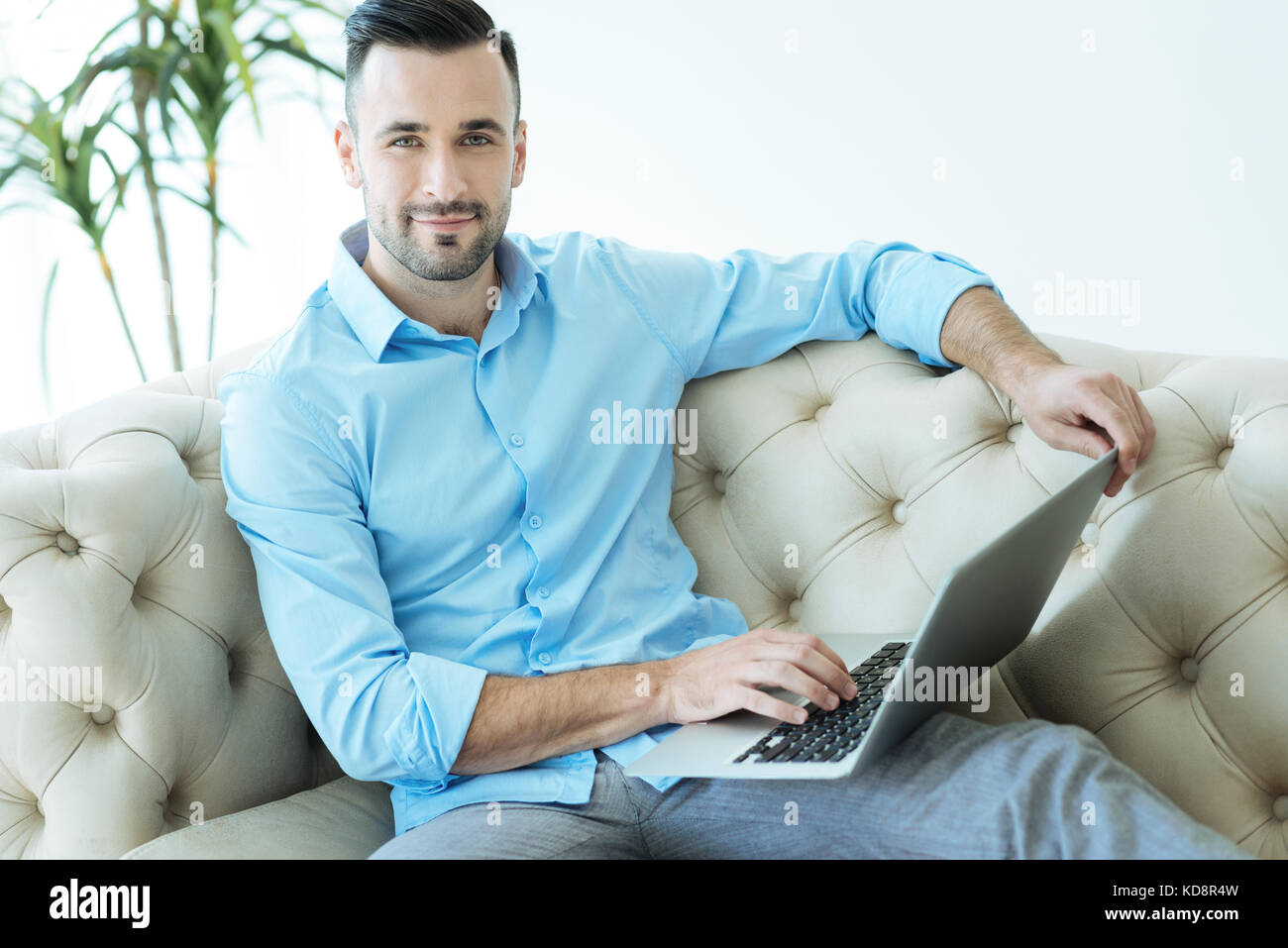 Handsome self employed man looking into camera Stock Photo - Alamy