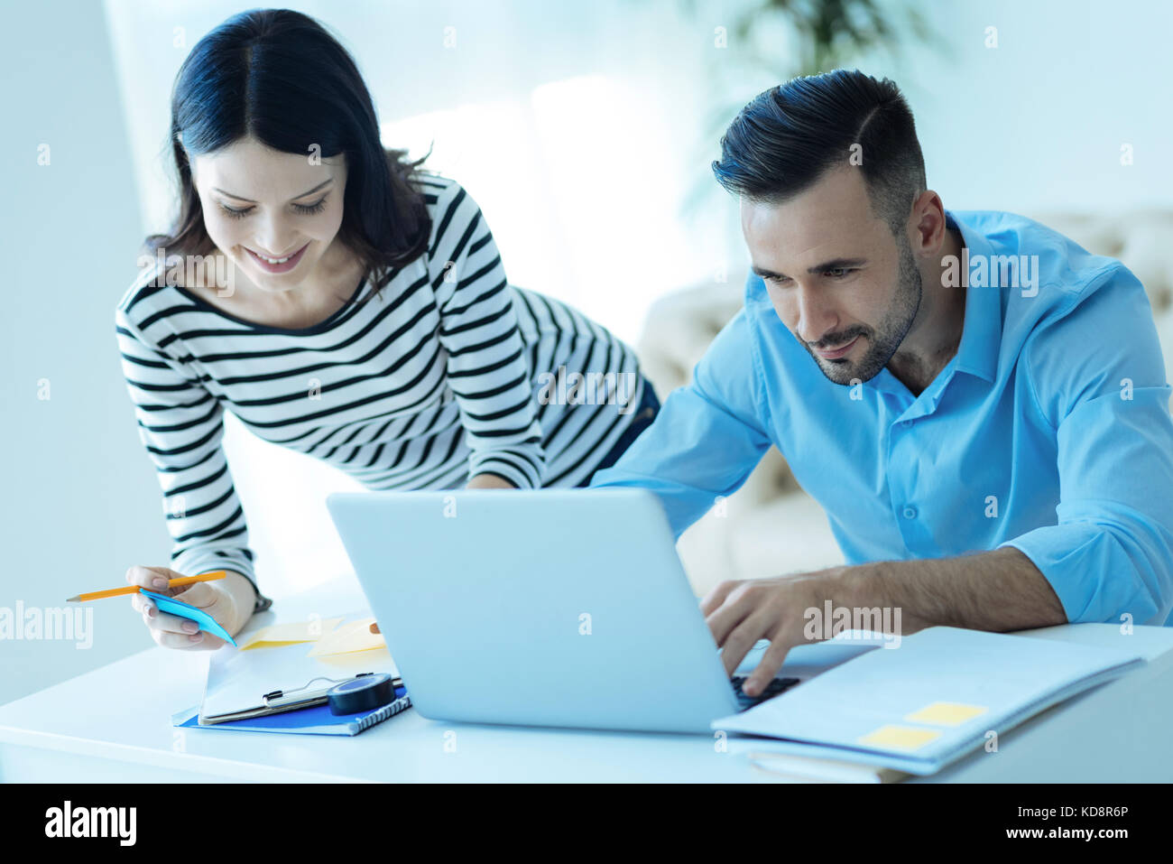 Friendly colleagues cooperation giver project Stock Photo - Alamy