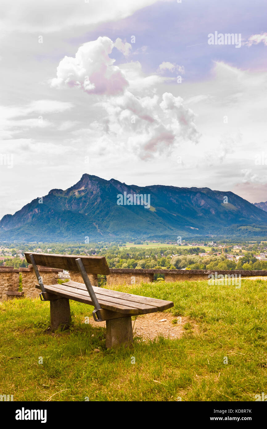 Bench with a beautiful mountain landscape view. Austrian alps. View of ...