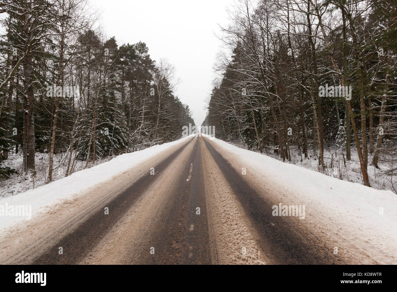 Road under the snow Stock Photo - Alamy