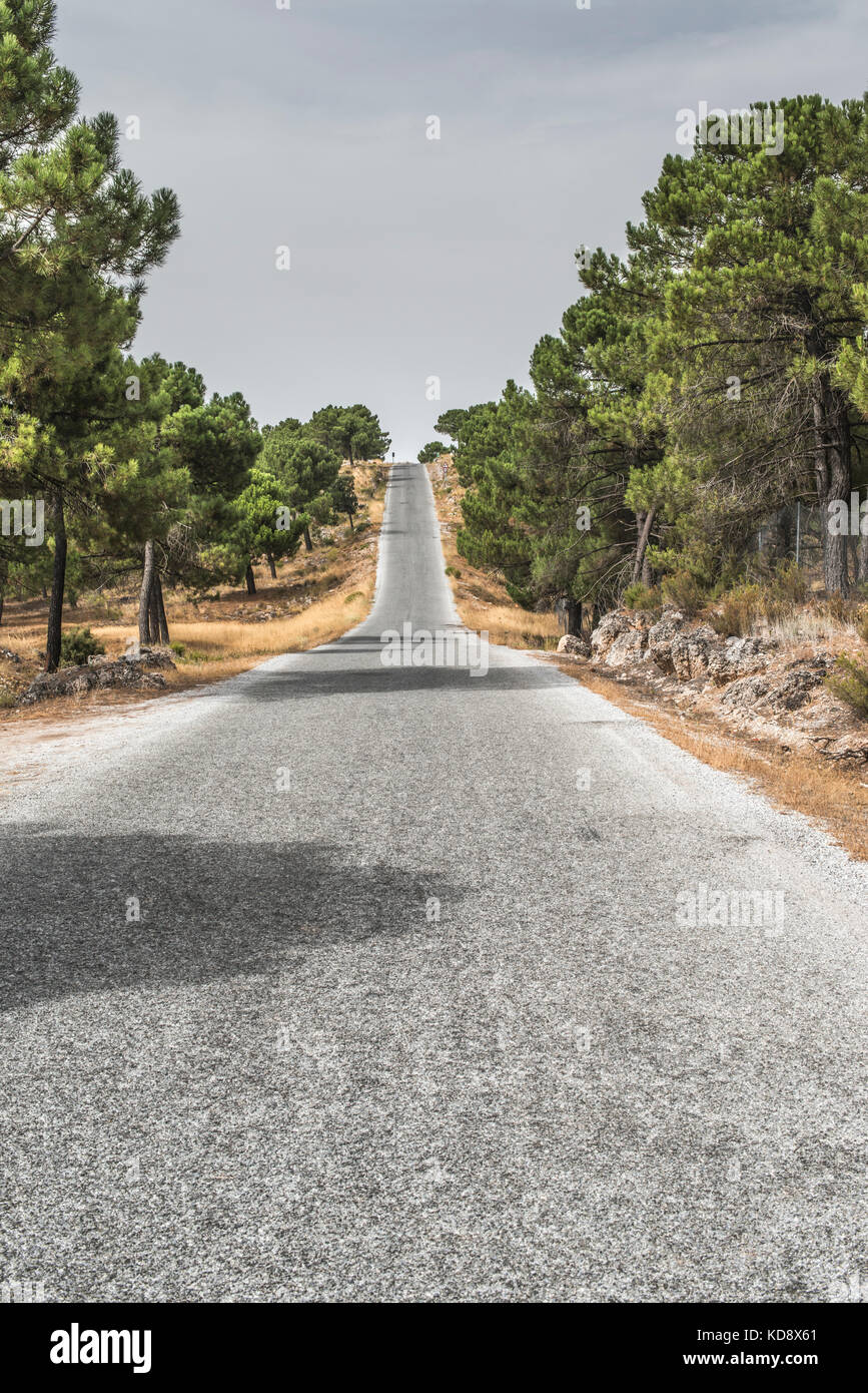 Road in the mountain. Dramatic scene Stock Photo - Alamy
