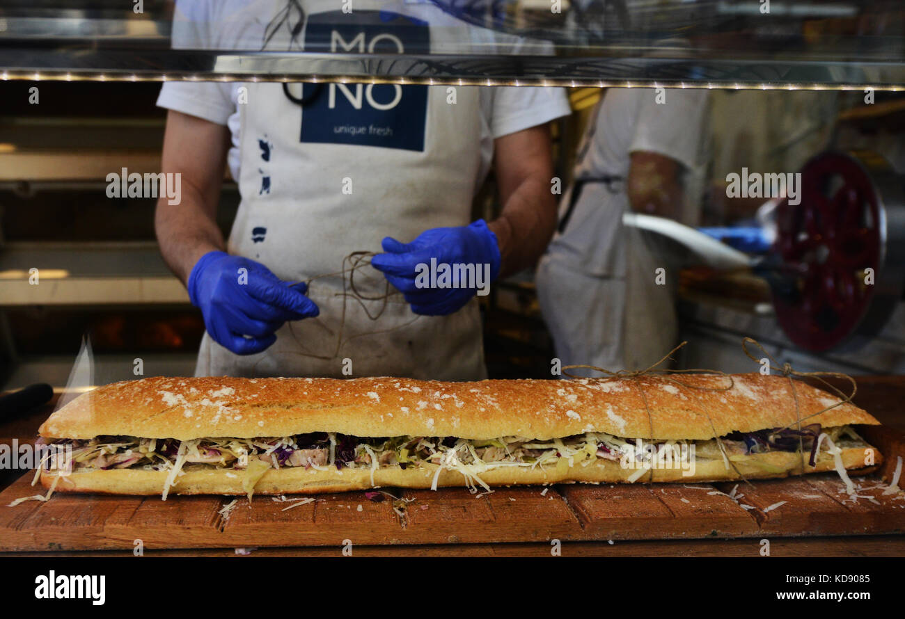 Preparing a super large sandwich in a sandwich bar in Thessaloniki ...