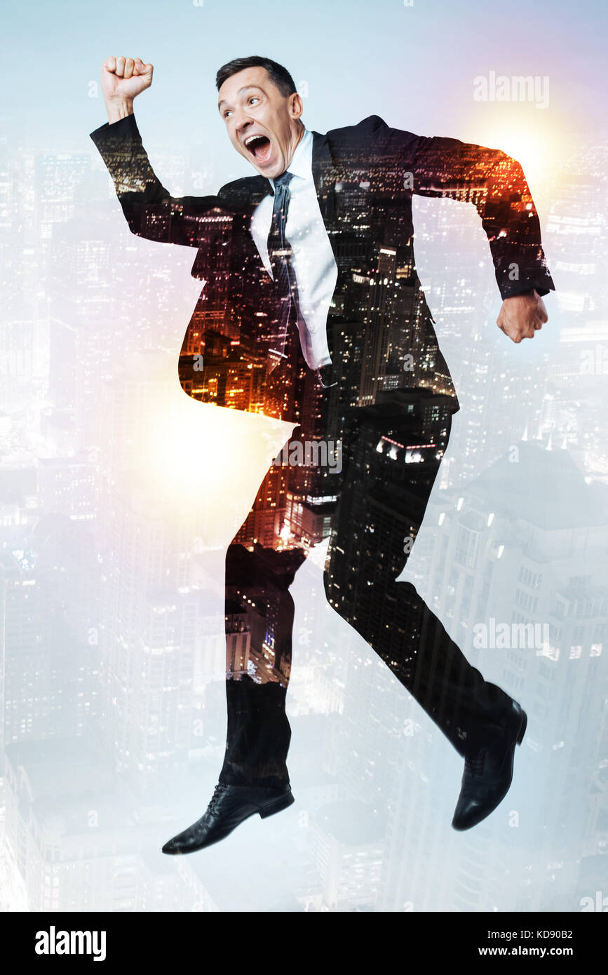 Positive manager in running position Stock Photo - Alamy