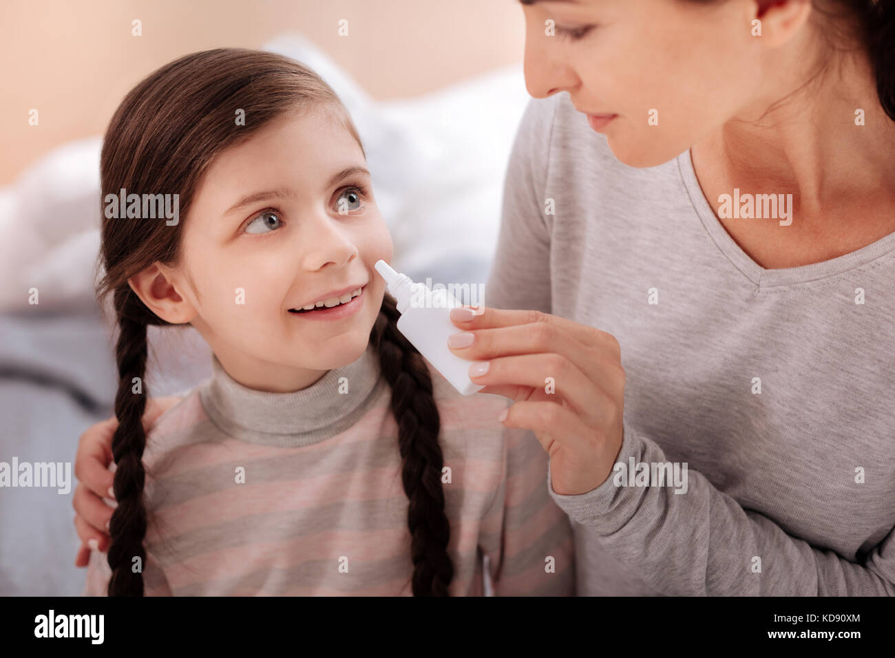 Happy child being cured by a loving mother Stock Photo - Alamy