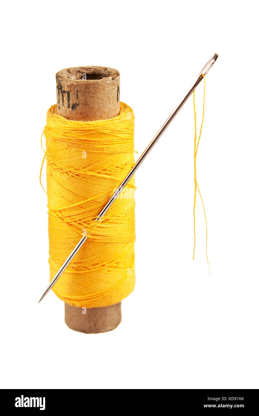 spool of thread and needle isolated on a white background Stock Photo ...