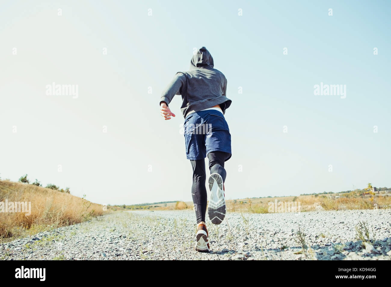 Running sport. Man runner sprinting outdoor in scenic nature. Fit ...