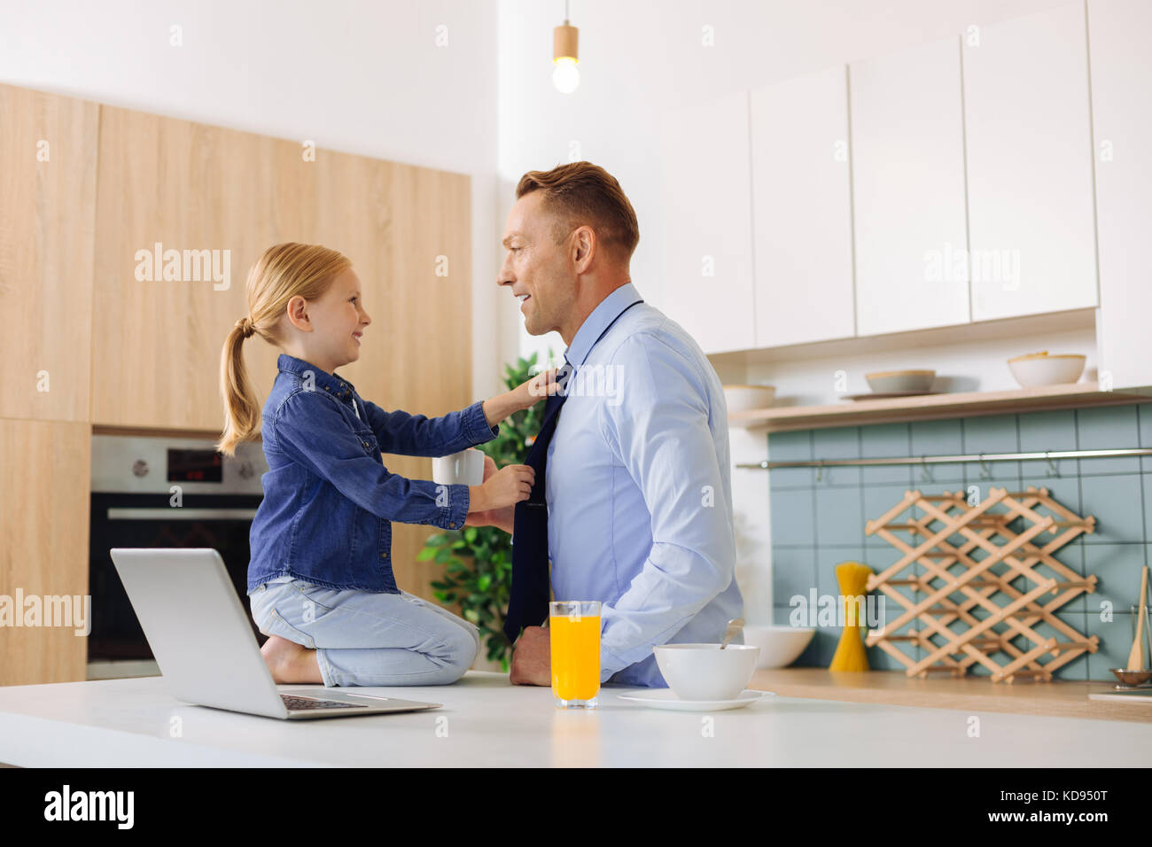 Helping her father hi-res stock photography and images - Alamy