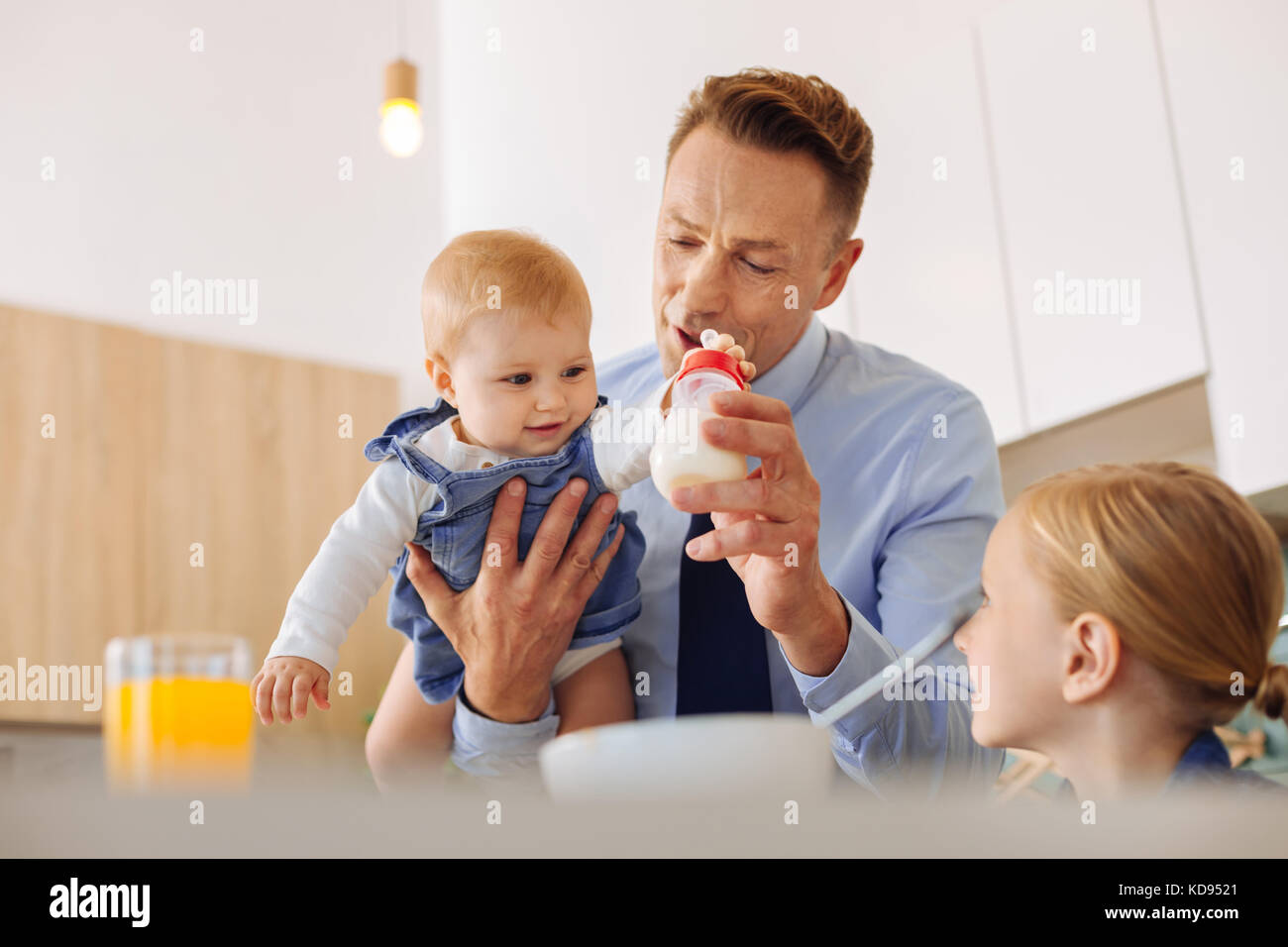 Happy small baby taking a bottle Stock Photo - Alamy