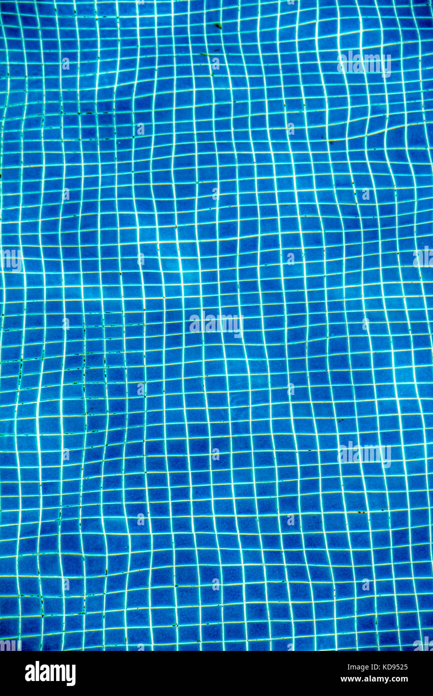 Blue ceramic under water in swimming pool Stock Photo - Alamy