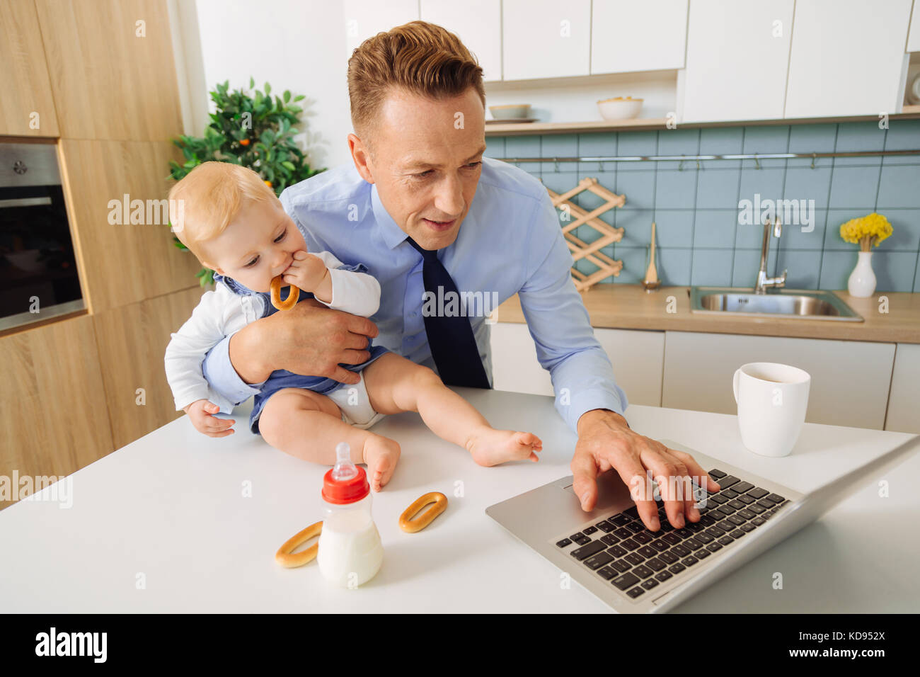 Nice pleasant man pressing a button Stock Photo - Alamy