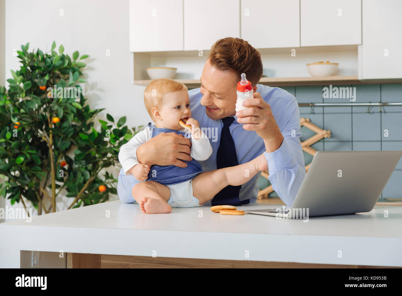 Father taking care of baby hi-res stock photography and images - Alamy