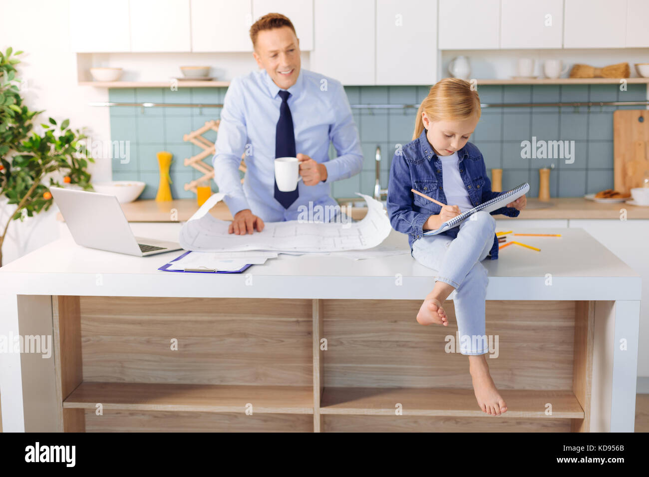 Nice serious girl doing a drawing Stock Photo - Alamy