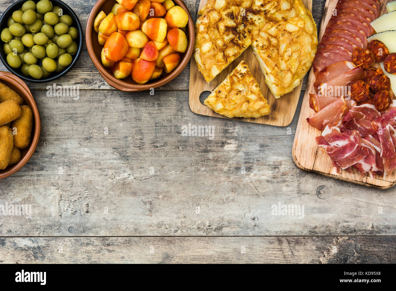 Traditional spanish tapas. Croquettes, olives, omelette, ham and ...