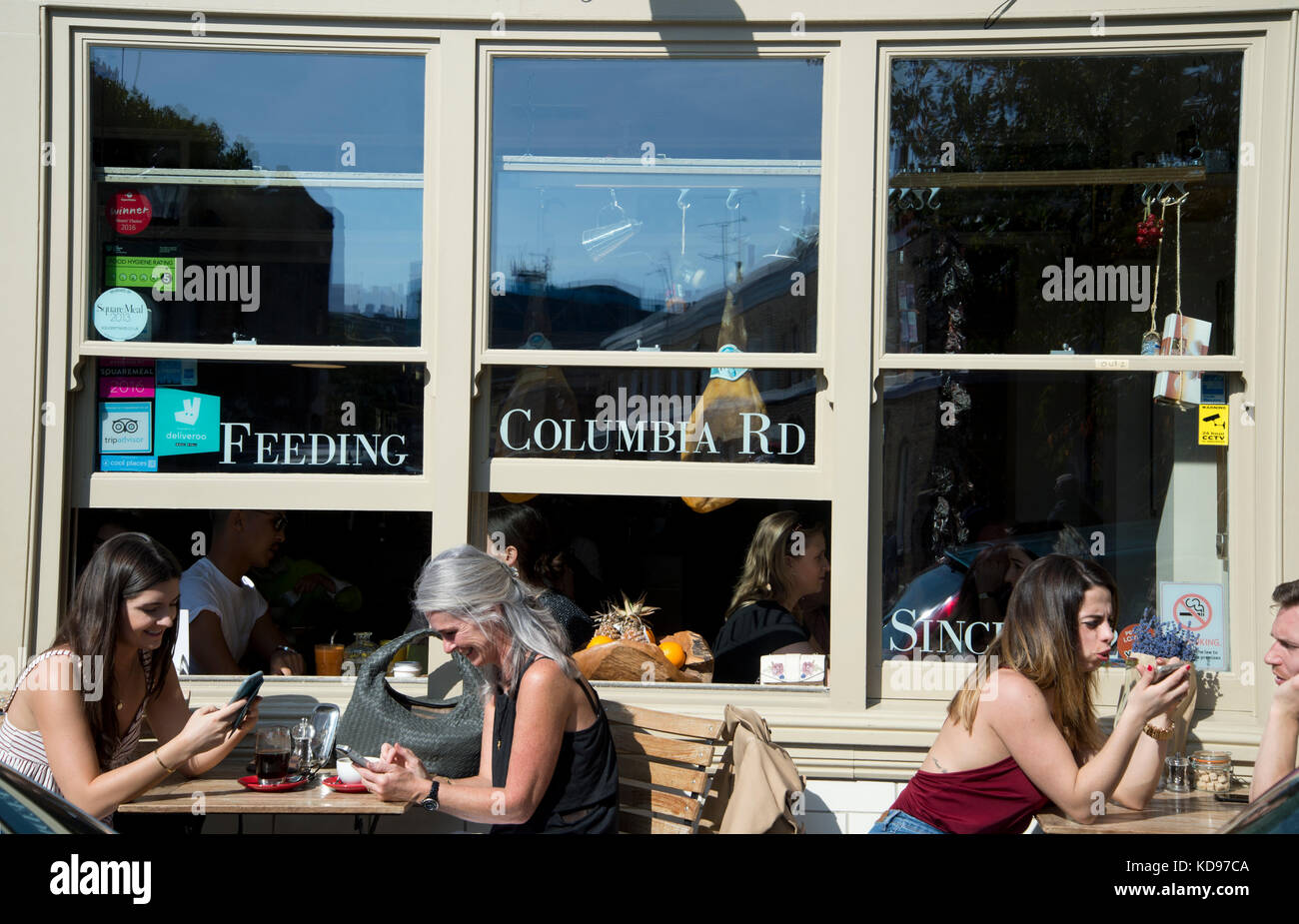 Colombia Road, Tower Hamlets. Sunday morning . Three women on their ...