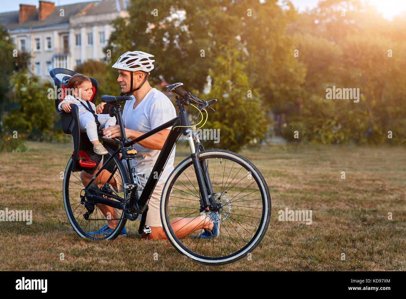 Happy family of three enjoying their time together in the park Stock ...