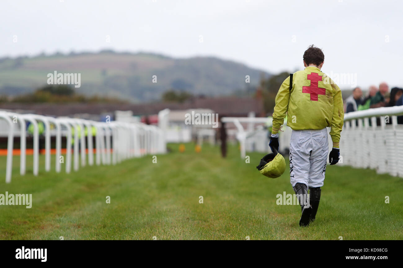 Jockey Max Kendrick makes his way back after falling in the Rowles Fine ...