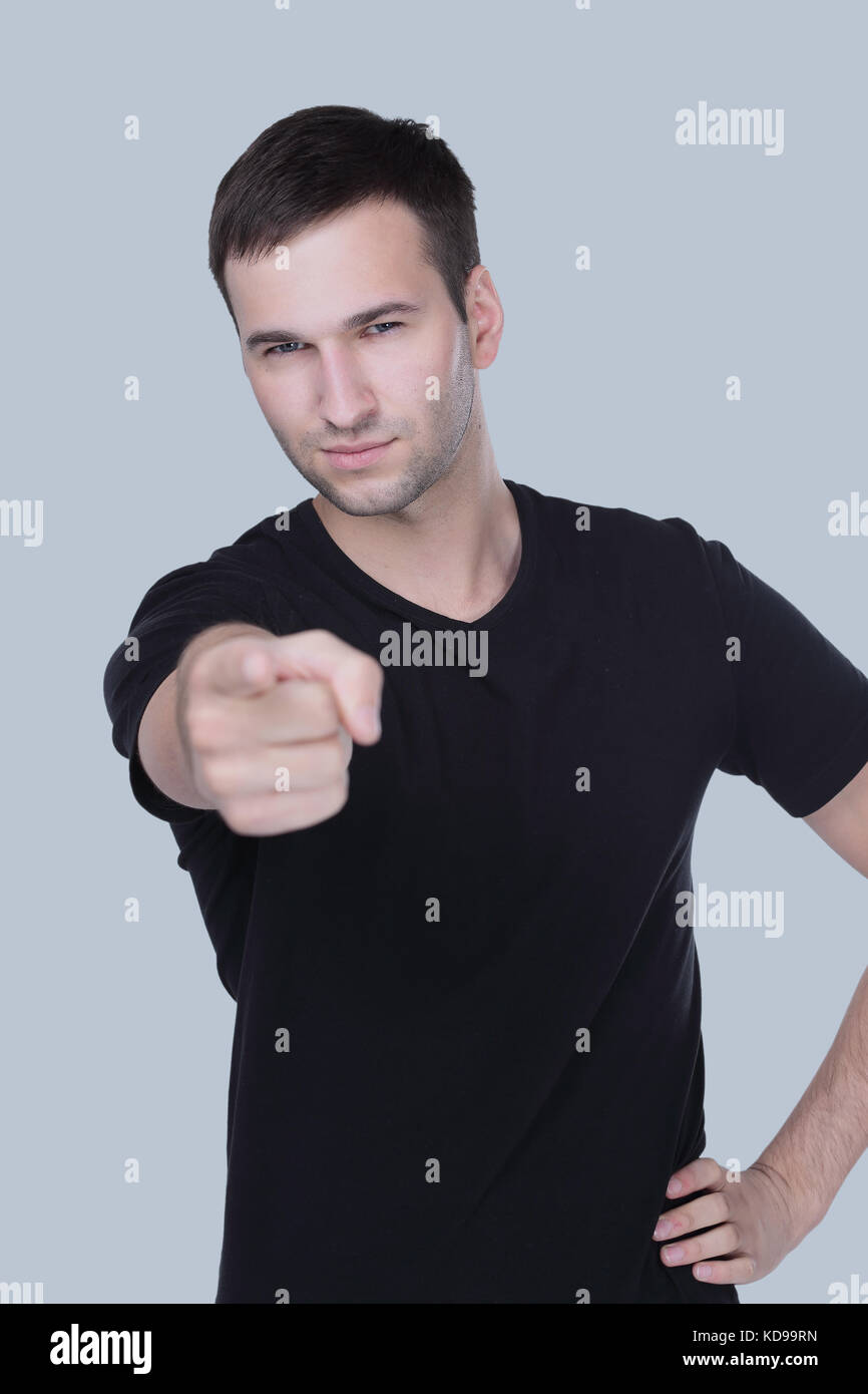 Young man points a finger straight isolated on gray background Stock ...