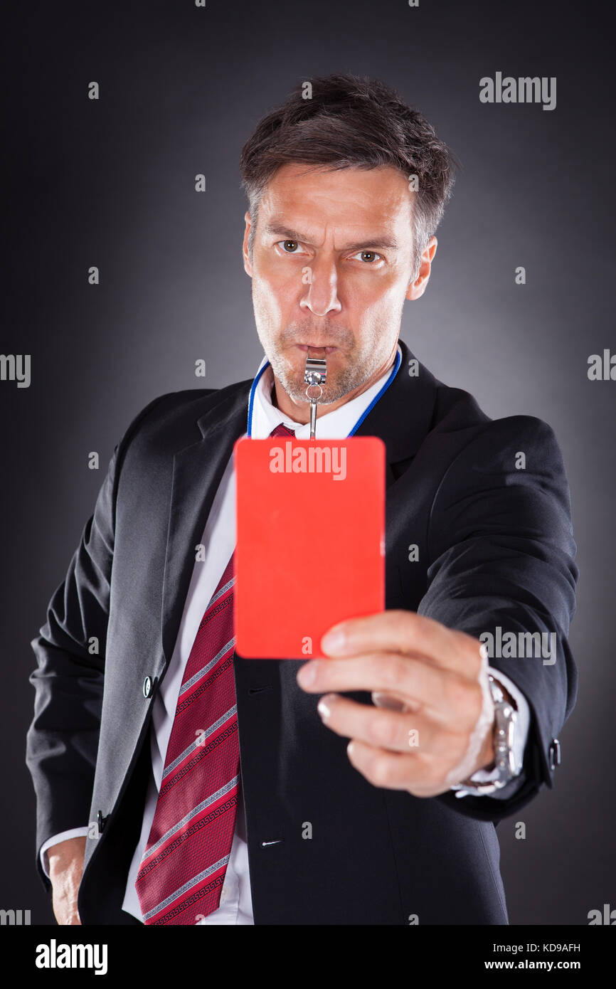 Portrait Of A Mature Businessman Showing Red Card Black Background ...