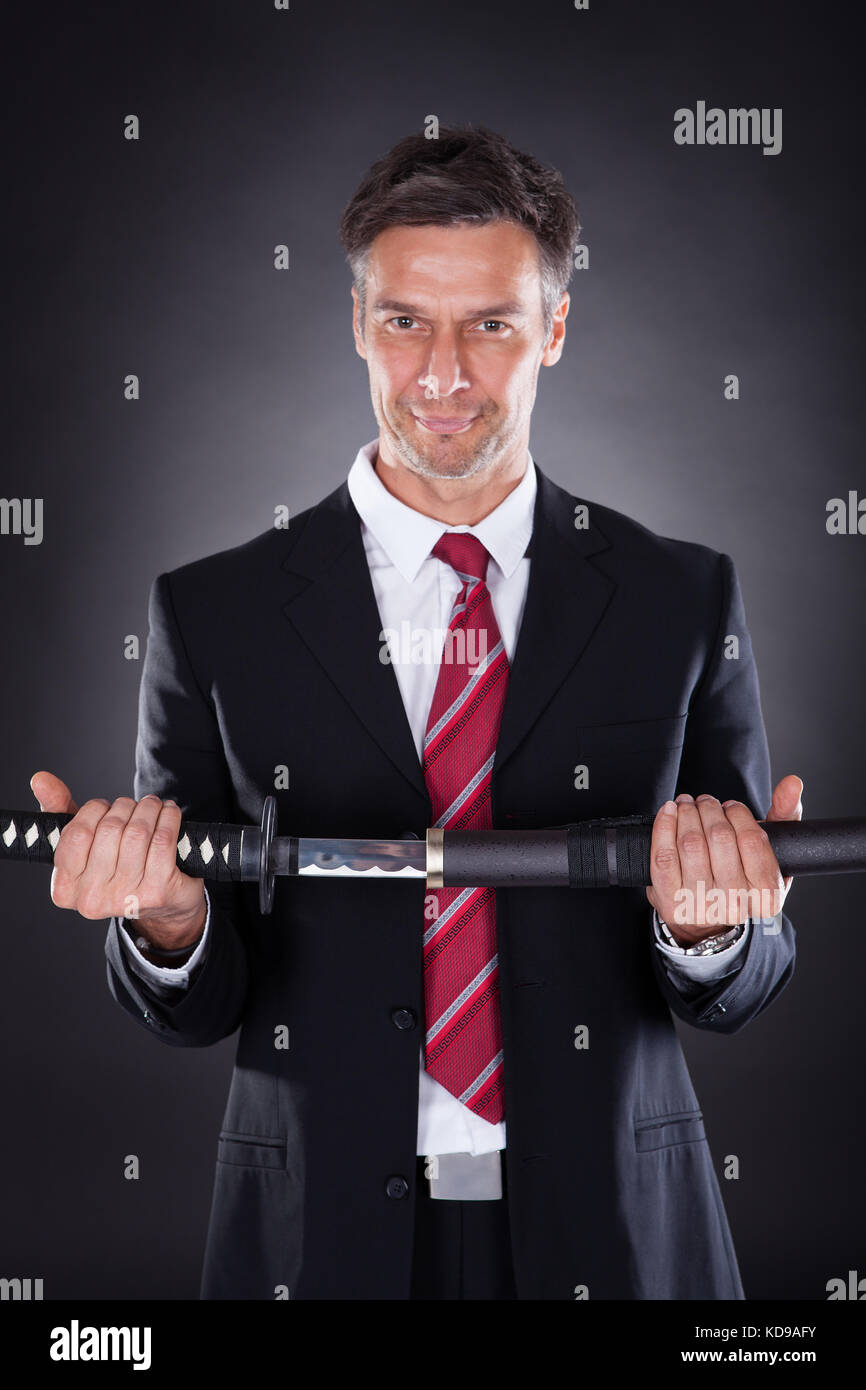 Hand holding sword hi-res stock photography and images - Alamy