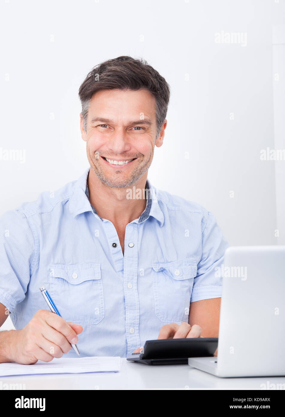 Portrait Of A Happy Mature Man Calculating Finance Stock Photo - Alamy Portrait Of A Happy Mature Man Calculating Finance Stock Photo - Alamy