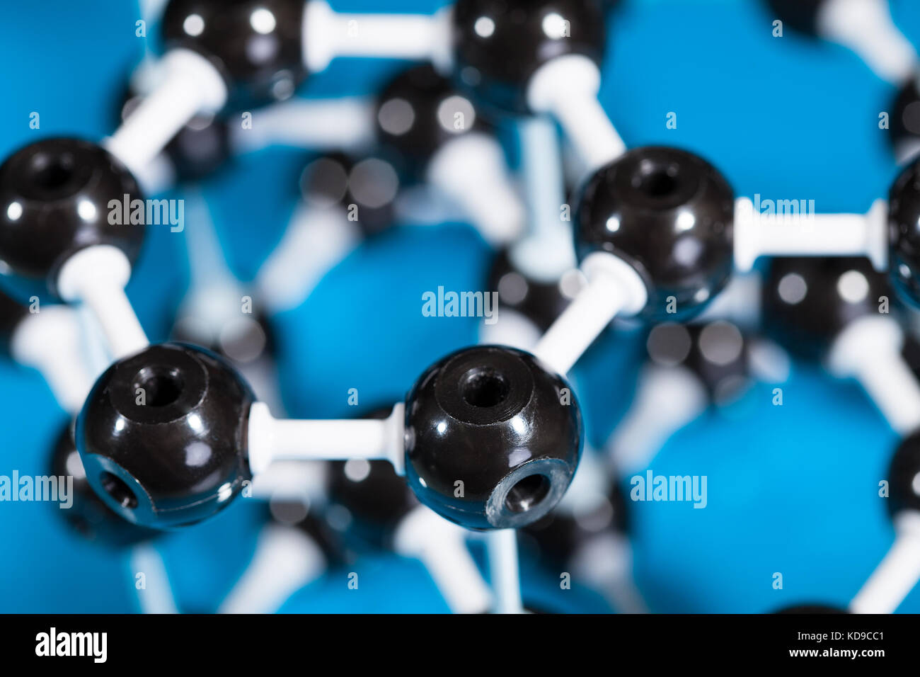 Model Of Graphite Molecular Structure On Green Reflective Background