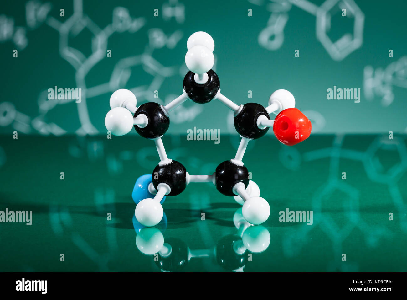 Model of molecular structure on green reflective background Stock Photo ...