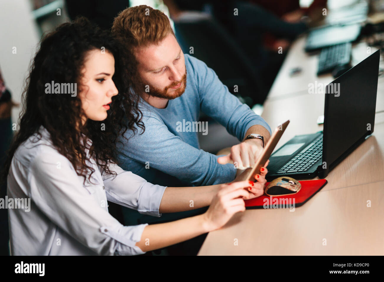 Portrait of software engineers using digital tablet Stock Photo - Alamy