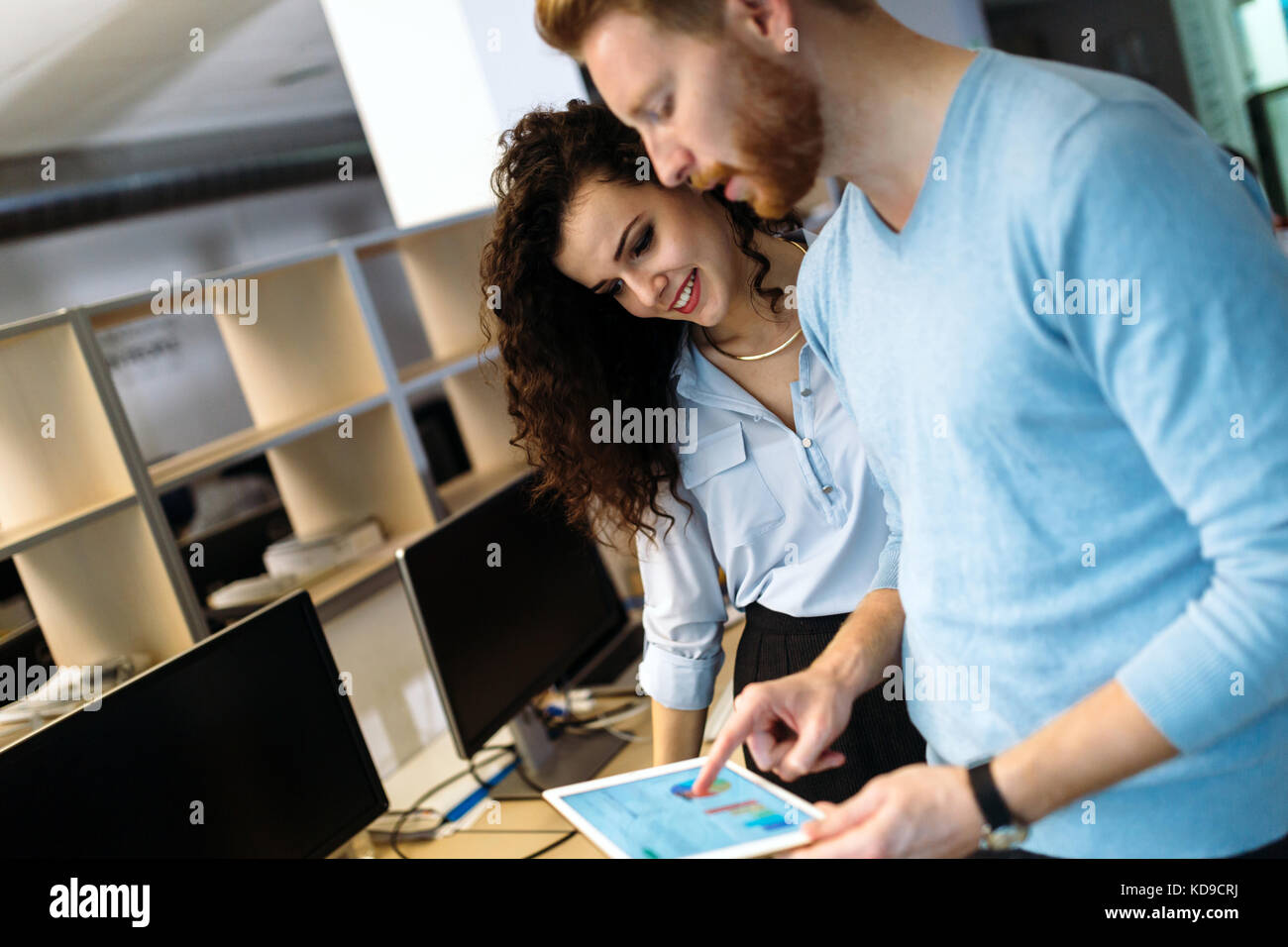 Portrait of software engineers using digital tablet Stock Photo - Alamy