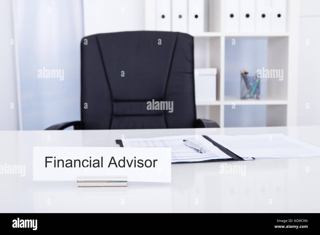 Photo Of Financial Advisor On Nameplate At Workplace Stock Photo - Alamy