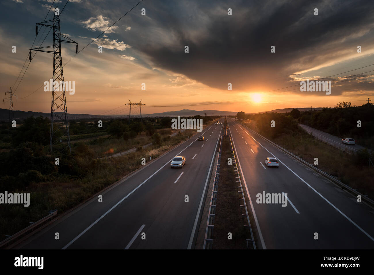 Cars highway sunset sky car hi-res stock photography and images - Alamy