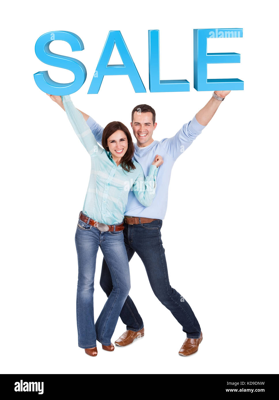 Happy young couple holding sale sign. Isolated on white Stock Photo - Alamy