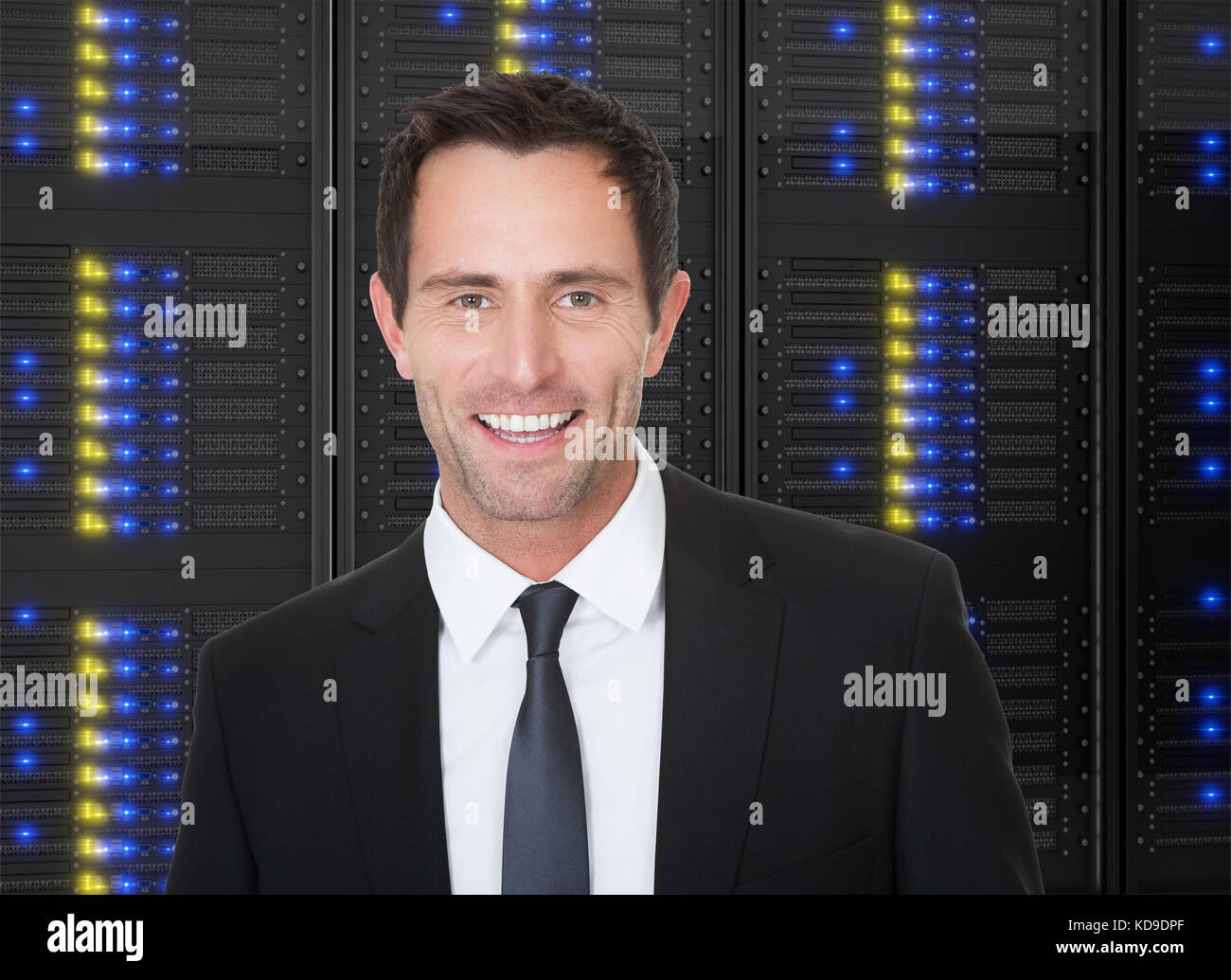 Photos of businessman standing in front of server racks Stock Photo - Alamy