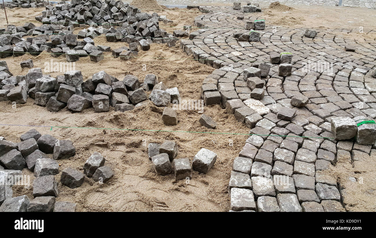 Reconstruction of a paved road in an old town Stock Photo - Alamy