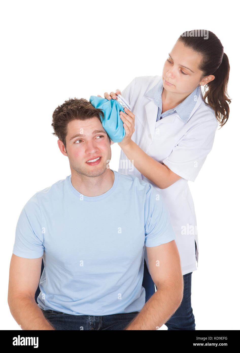 Doctor Giving Treatment To Patient With Icepack On White Background ...