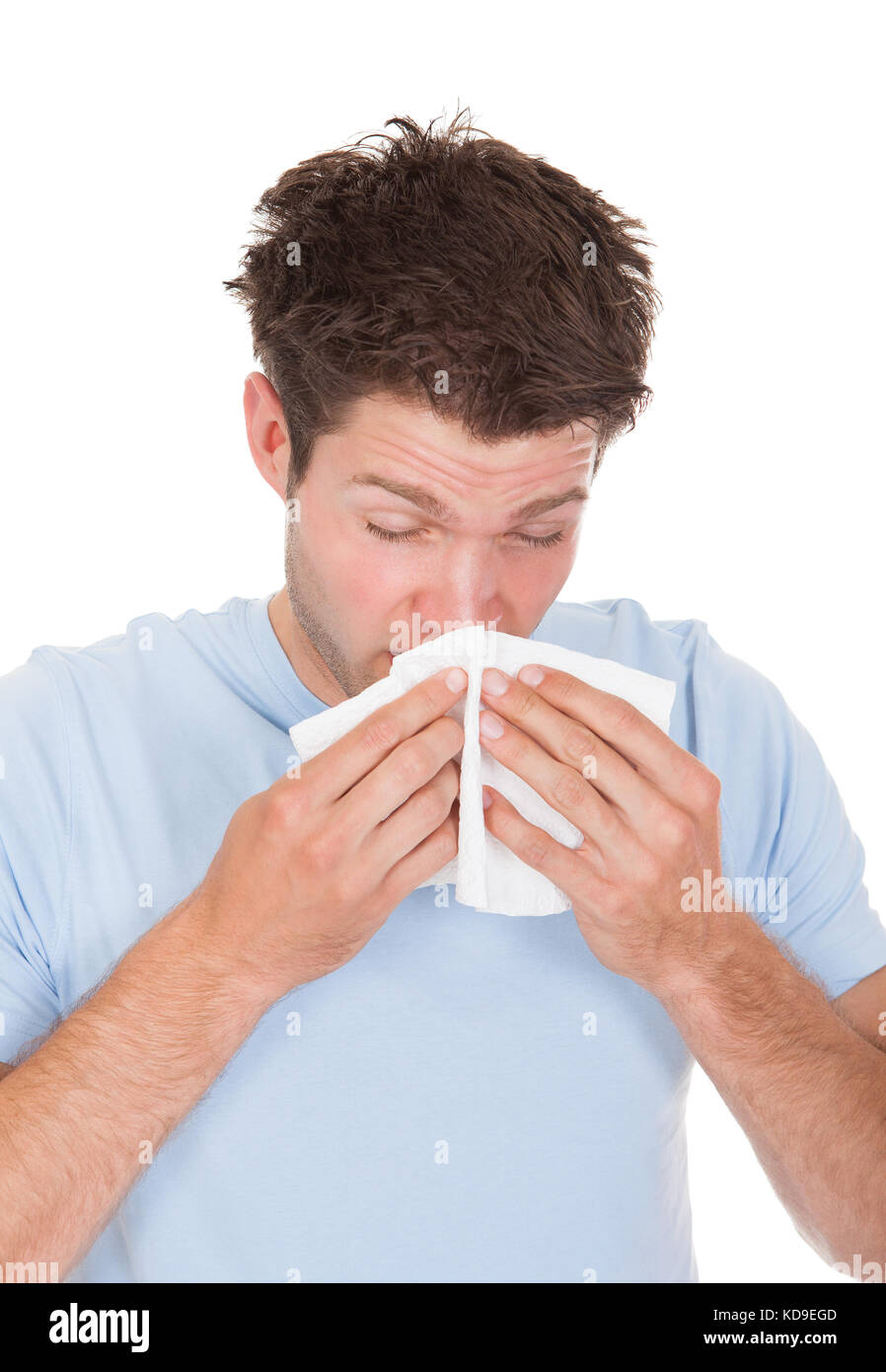 Young Man Sneezing In Tissue Isolated On White Background Stock Photo ...