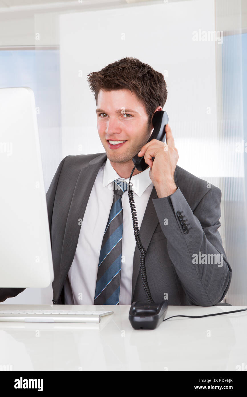 Businessman talking on the telephone hi-res stock photography and ...