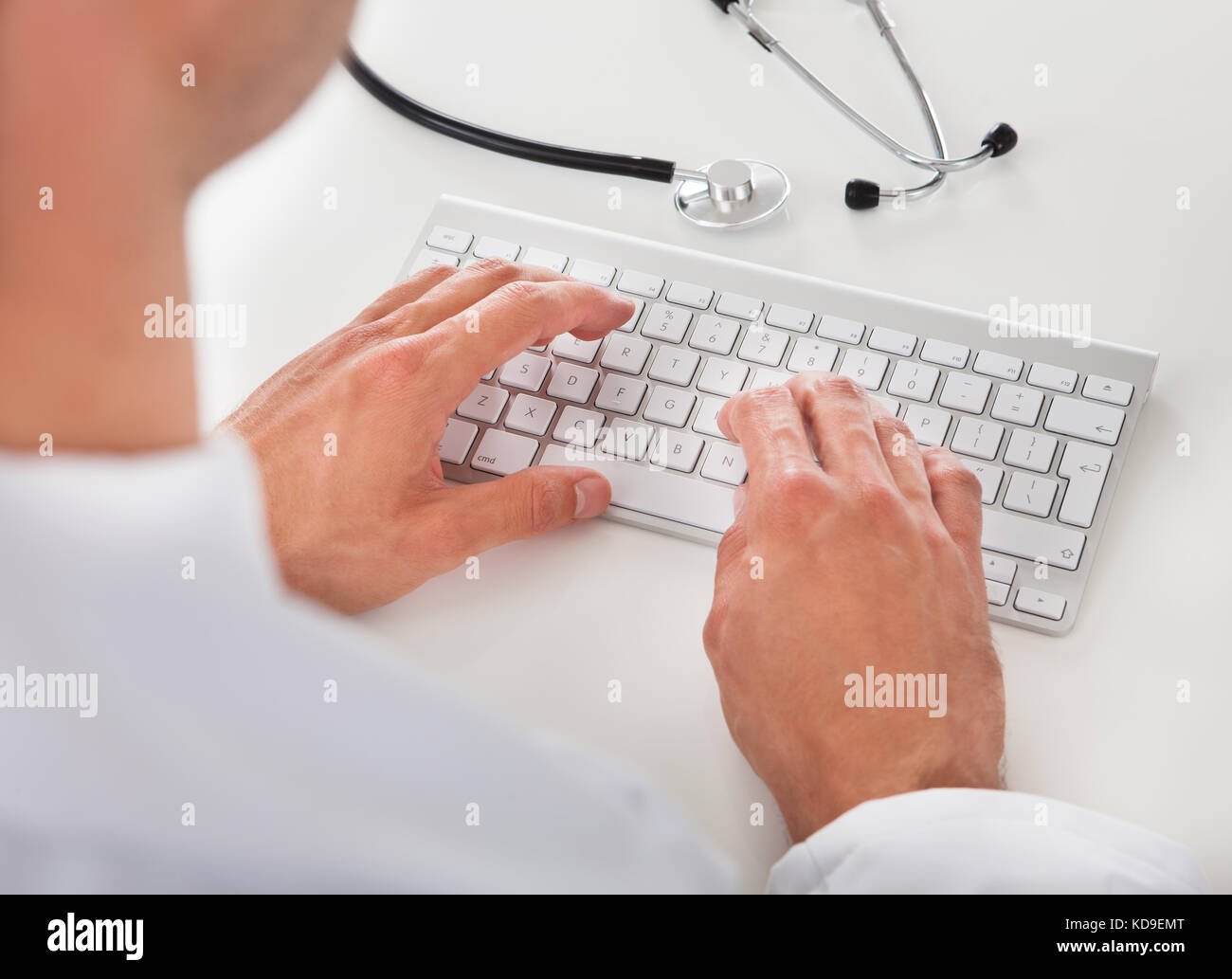 Close-up Of A Male Doctor Typing On Keyboard Stock Photo - Alamy